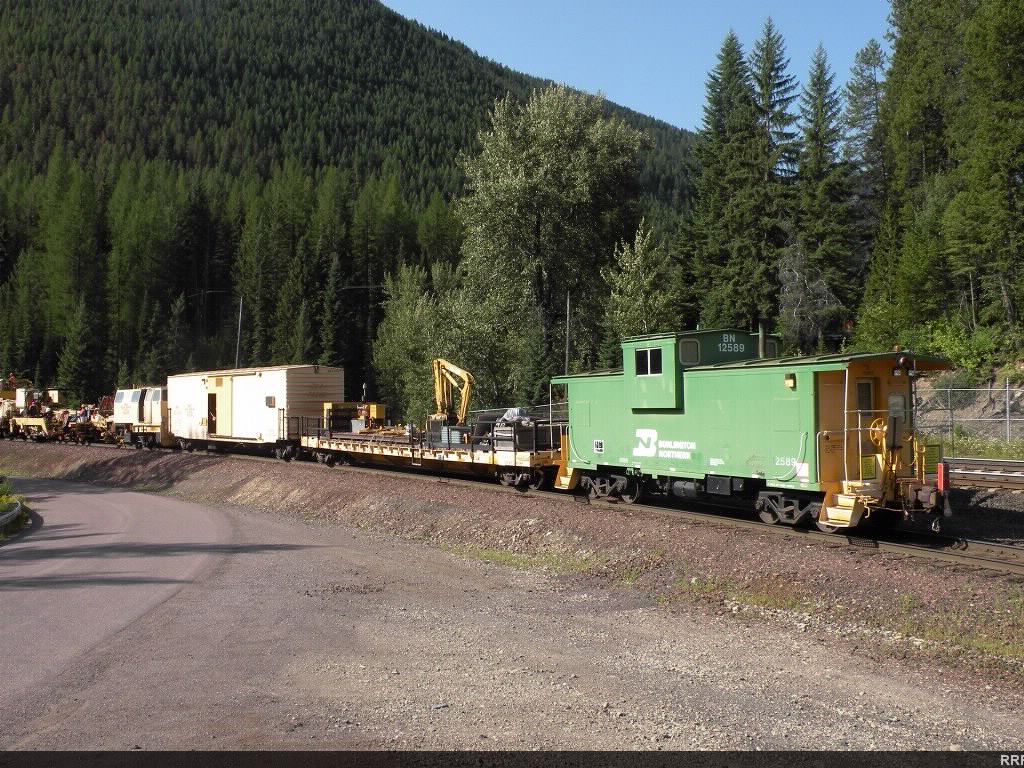 End of the tie laying train with a nice BN caboose.